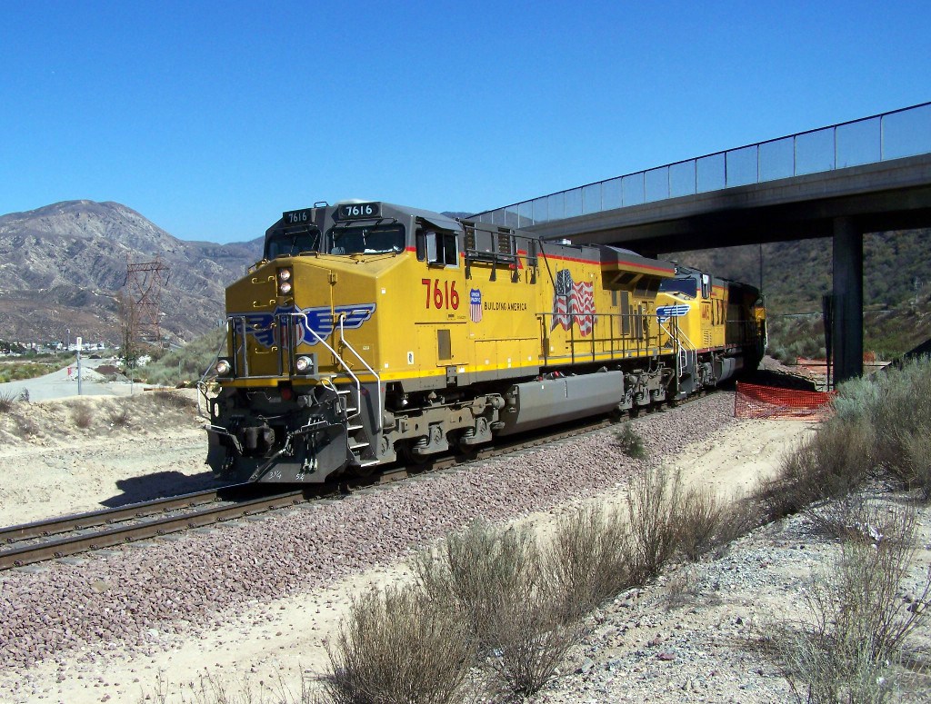 UP 7616 charges uphill on track 3 with a manifest